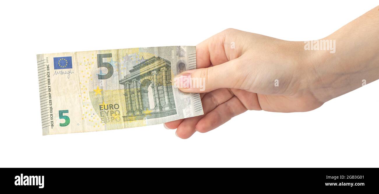 5 euro in hand isolated on white background, woman hand with banknote ...