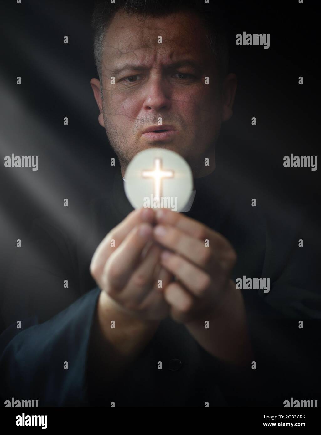 priest prays at the holy mass Stock Photo - Alamy
