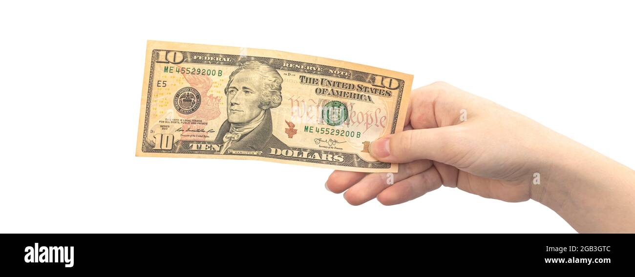 Ten dollars in hand isolated on white background, woman hand with ...