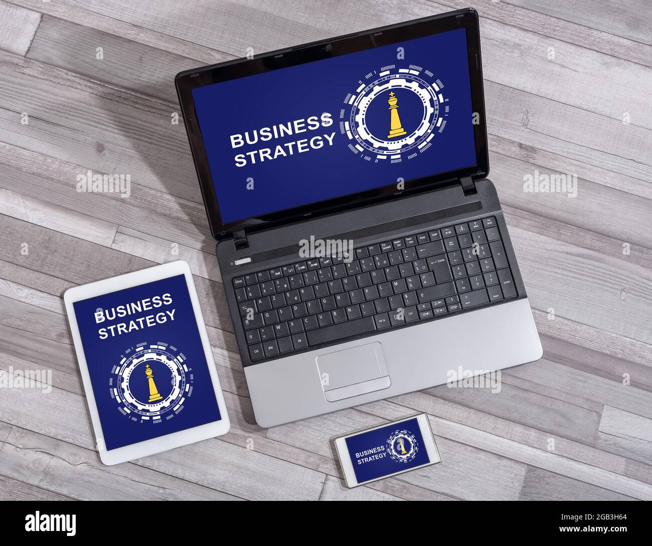 Business strategy concept shown on different information technology ...