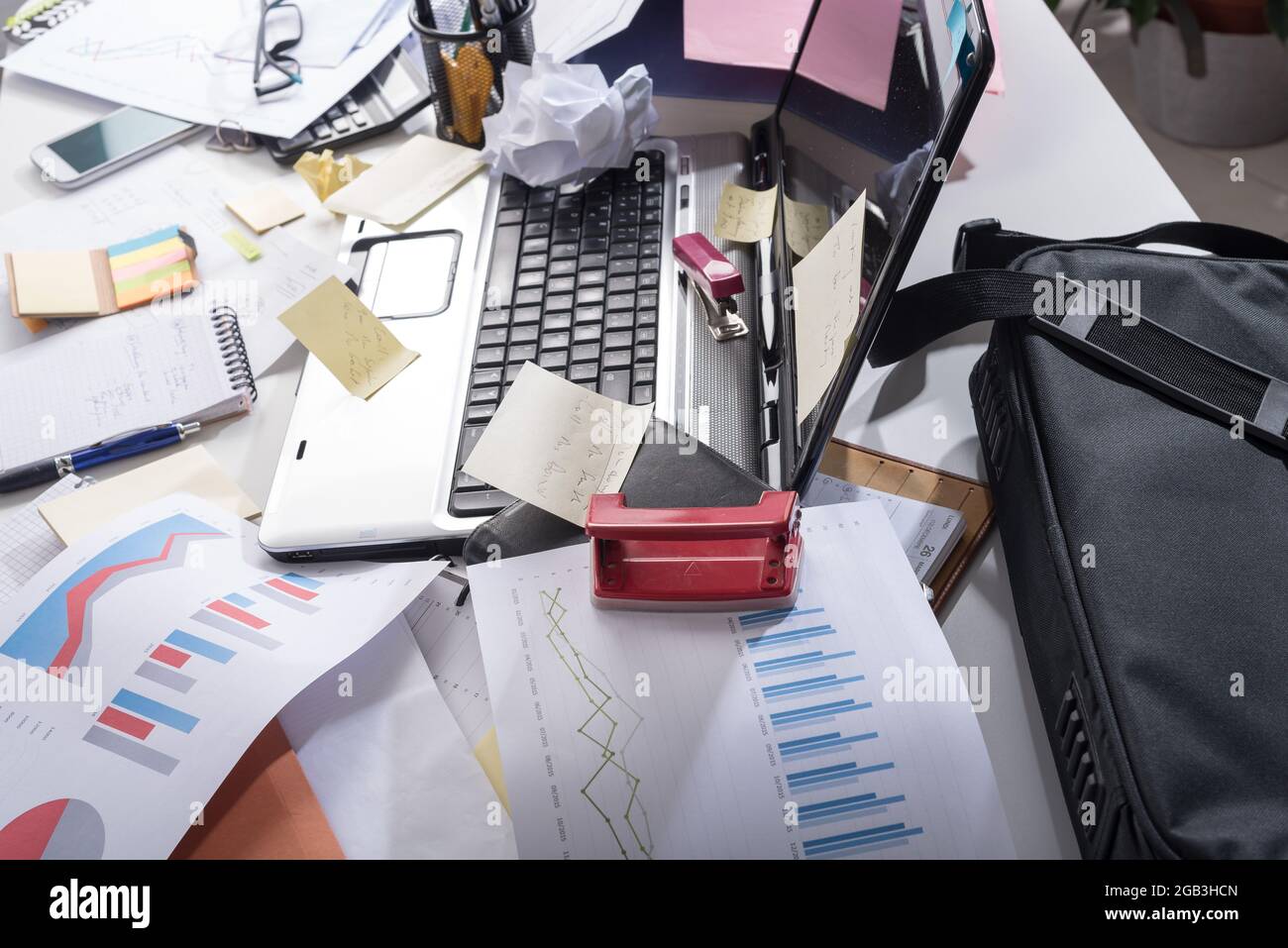 Messy and cluttered office desk Stock Photo - Alamy