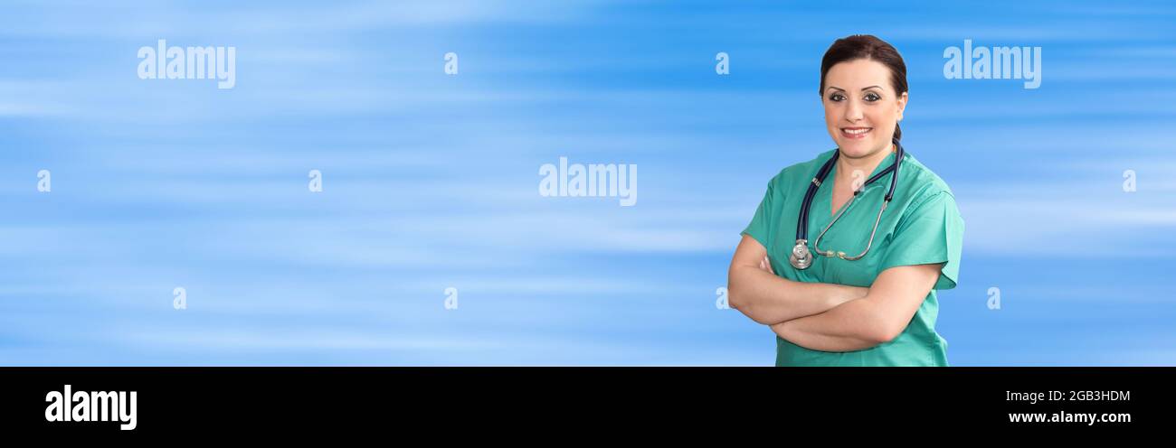 Portrait of female doctor on blue background Stock Photo - Alamy