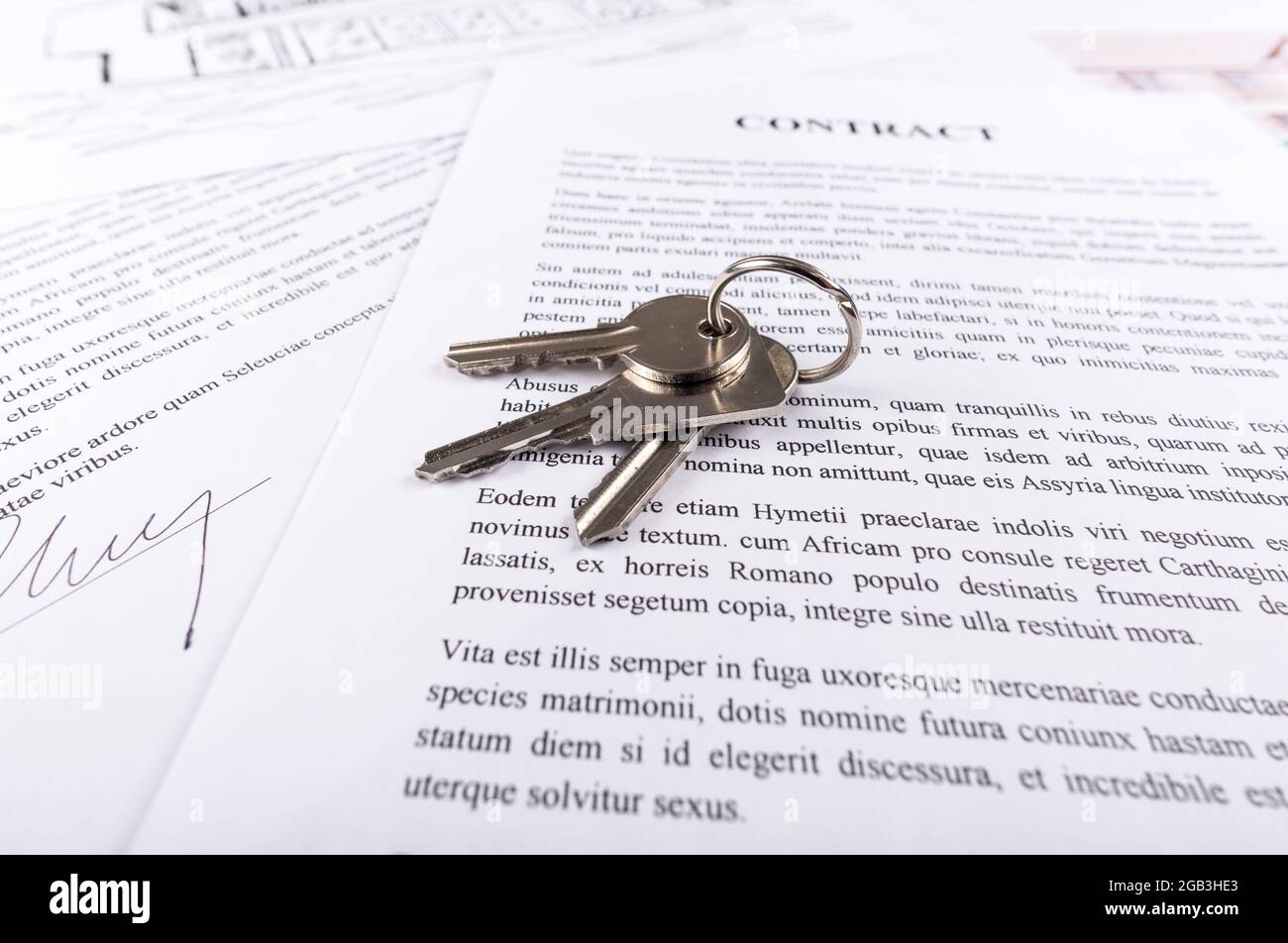Real estate contract with keys (random latin dummy text used Stock ...