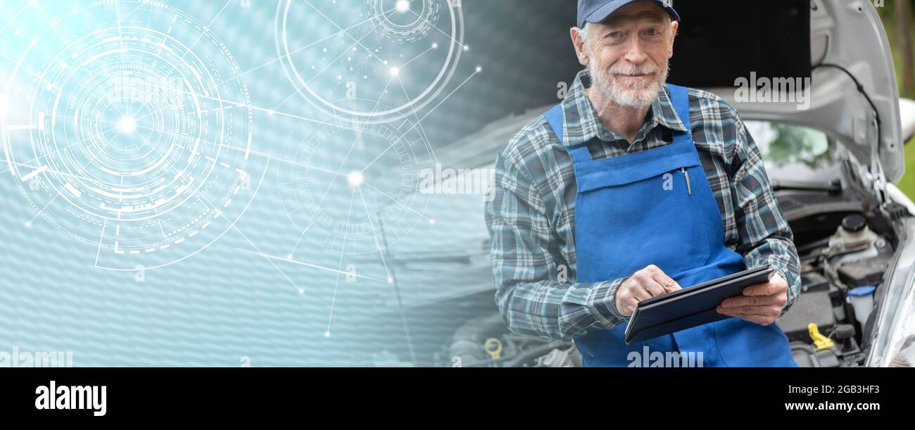 Car mechanic using digital tablet for checking car engine; panoramic ...