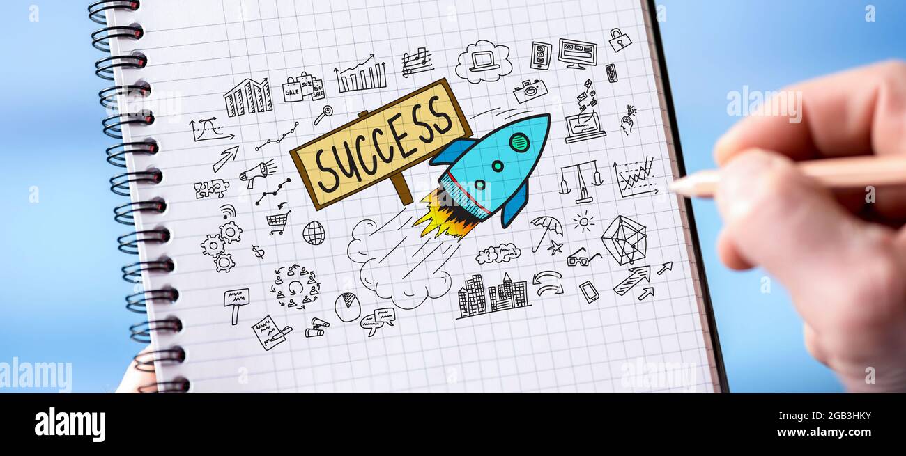 Hand drawing business success concept on a notepad Stock Photo - Alamy