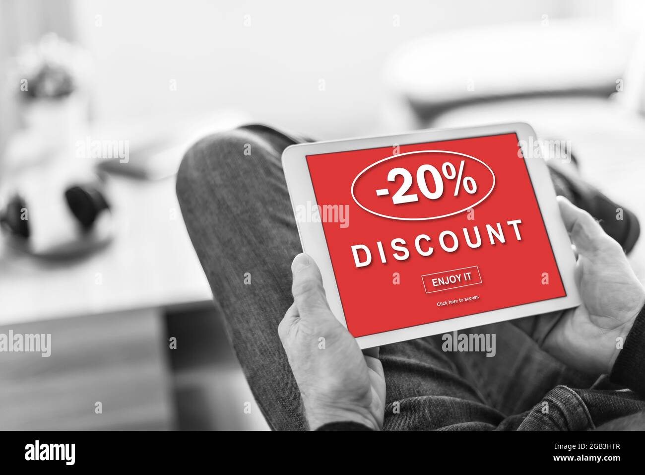Tablet screen displaying a discount concept Stock Photo - Alamy