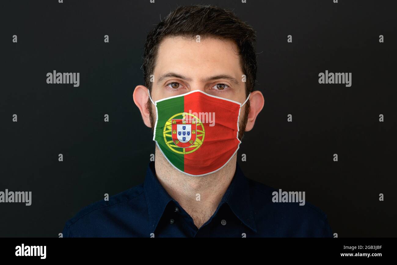 Man wearing Portuguese flag protective medical face mask. He looks ...