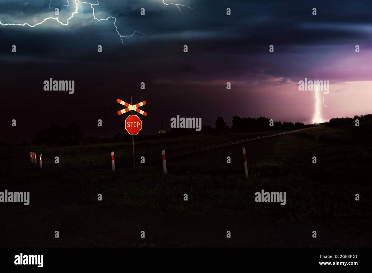 night storm and railroad crossing stop sign Stock Photo - Alamy