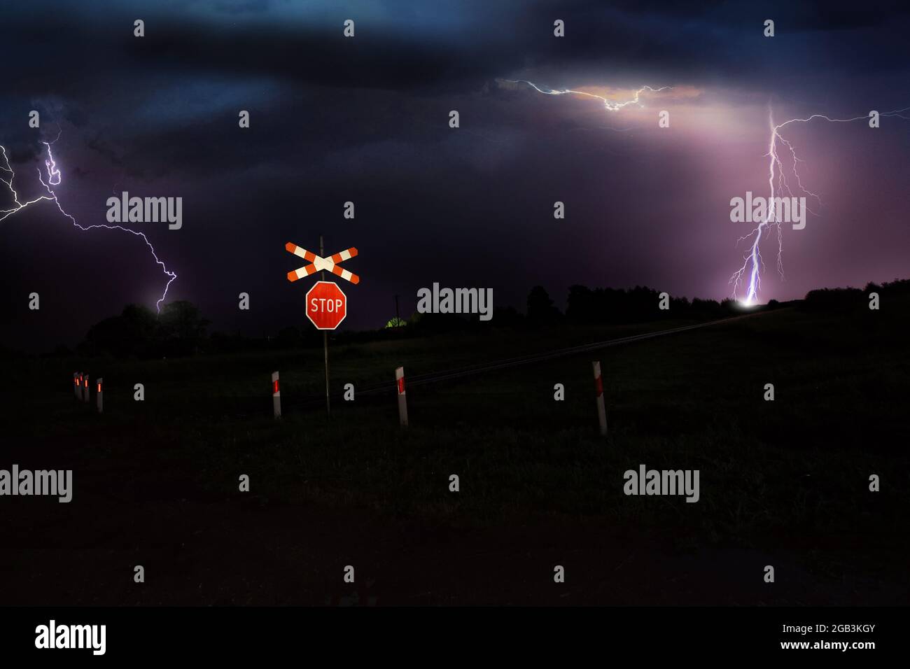 storm at night and railroad crossing stop sign Stock Photo - Alamy
