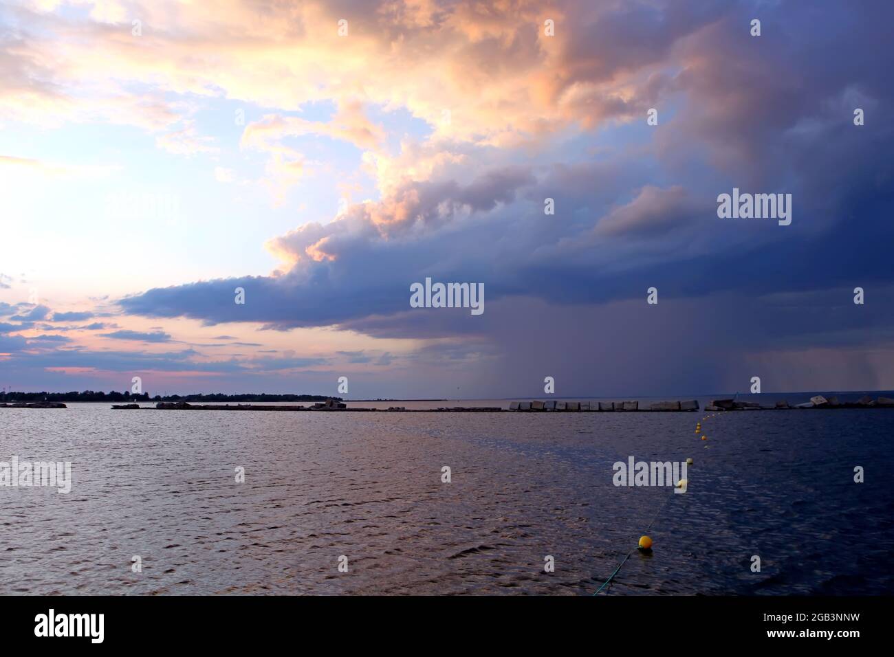 rain clouds in Tallinn. dramatic storming sunset on the baltic sea ...
