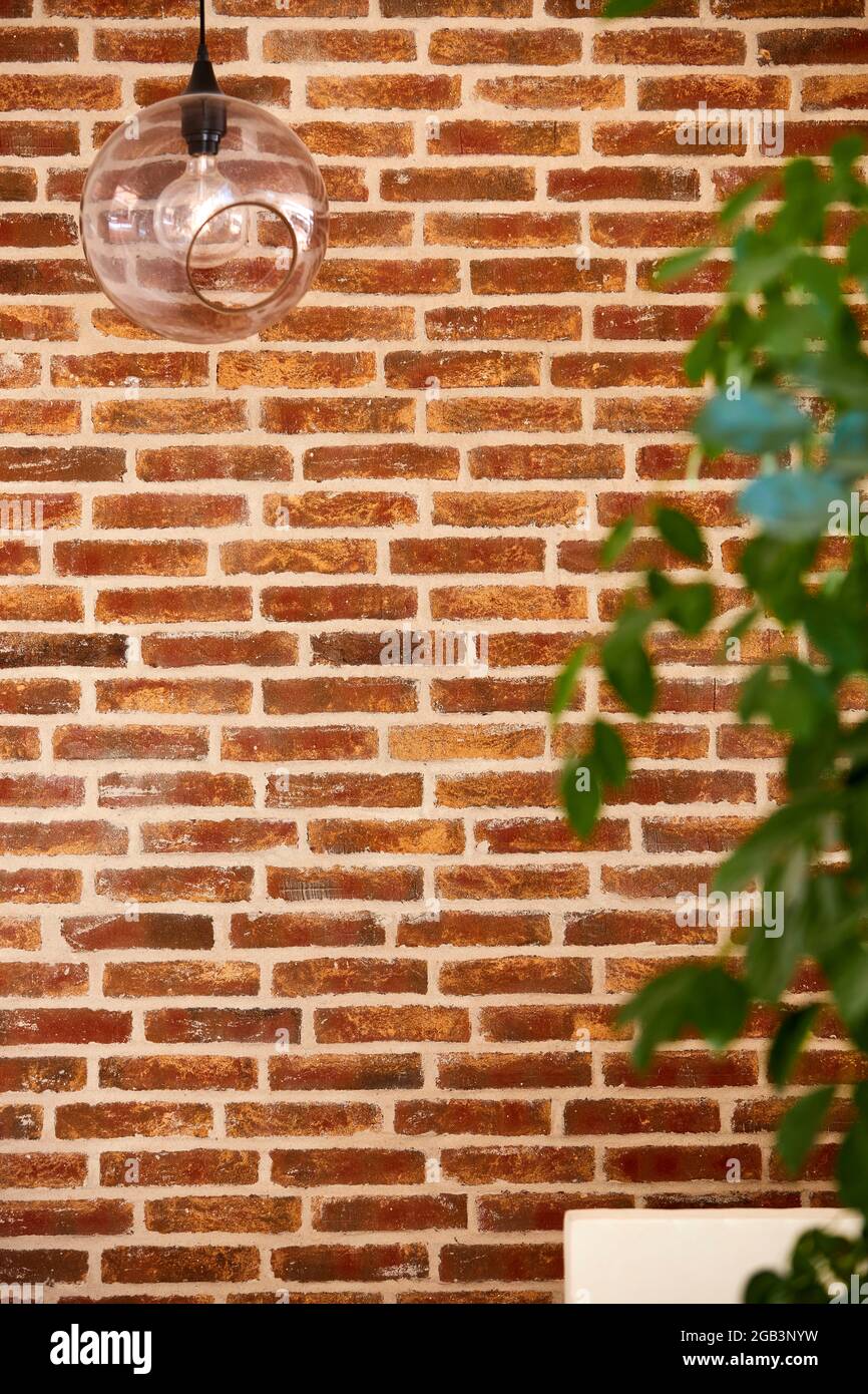 a brown brick wall with lights decor aesthetic Stock Photo - Alamy