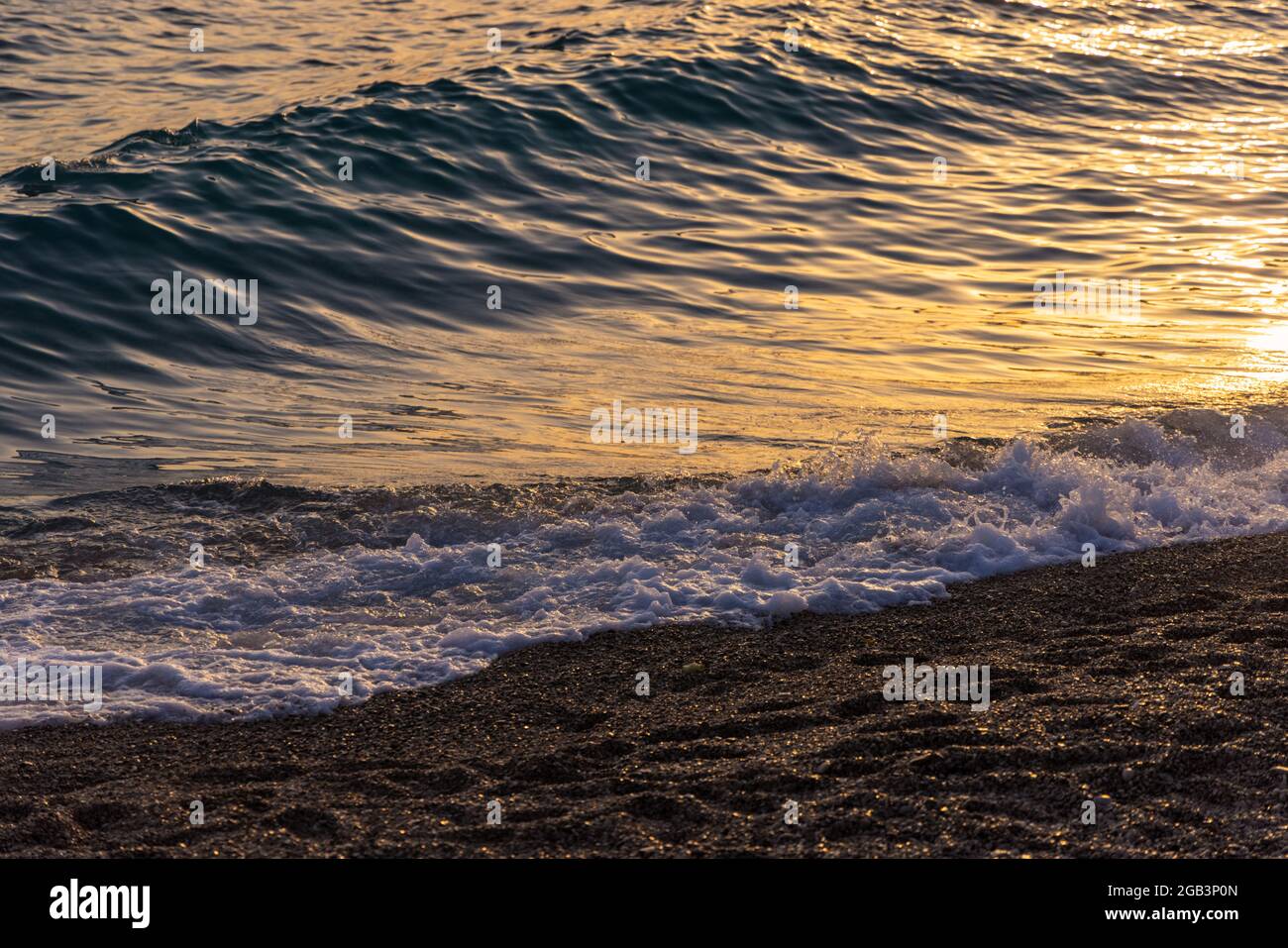 Sunset on the Zlatni Rat beach near Bol town, Brač Island, the Adriatic ...