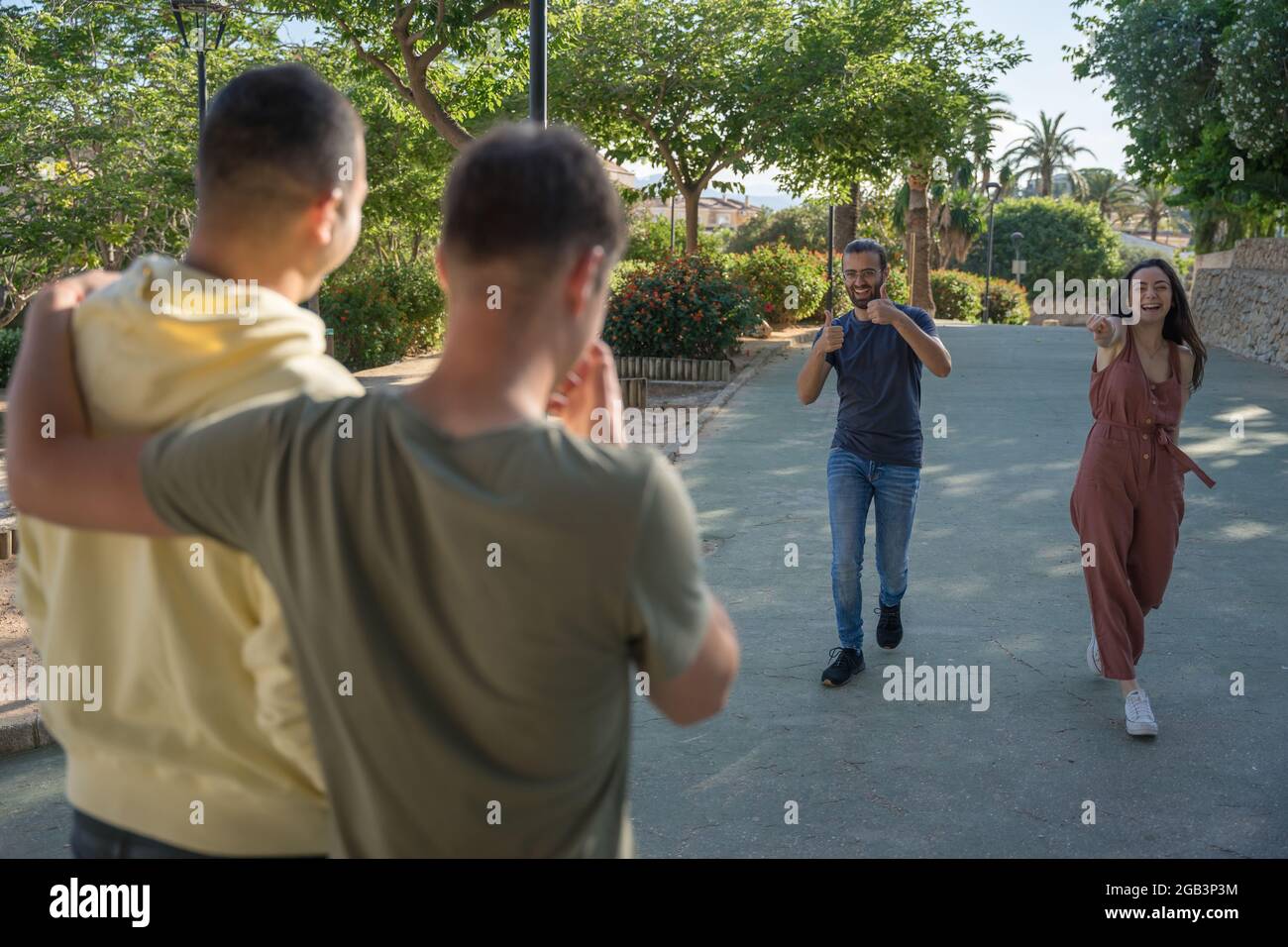 Friends waiting for their friends to arrive. They are arriving very ...