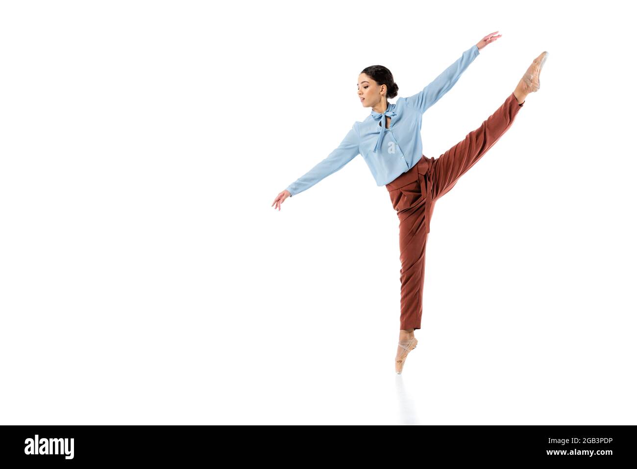 Side view of classical dancer exercising on white background Stock ...