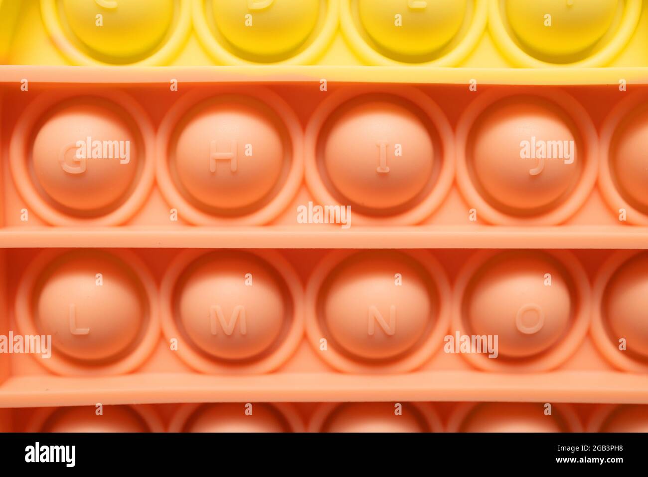 Rainbow pop it toy fidget background Stock Photo - Alamy