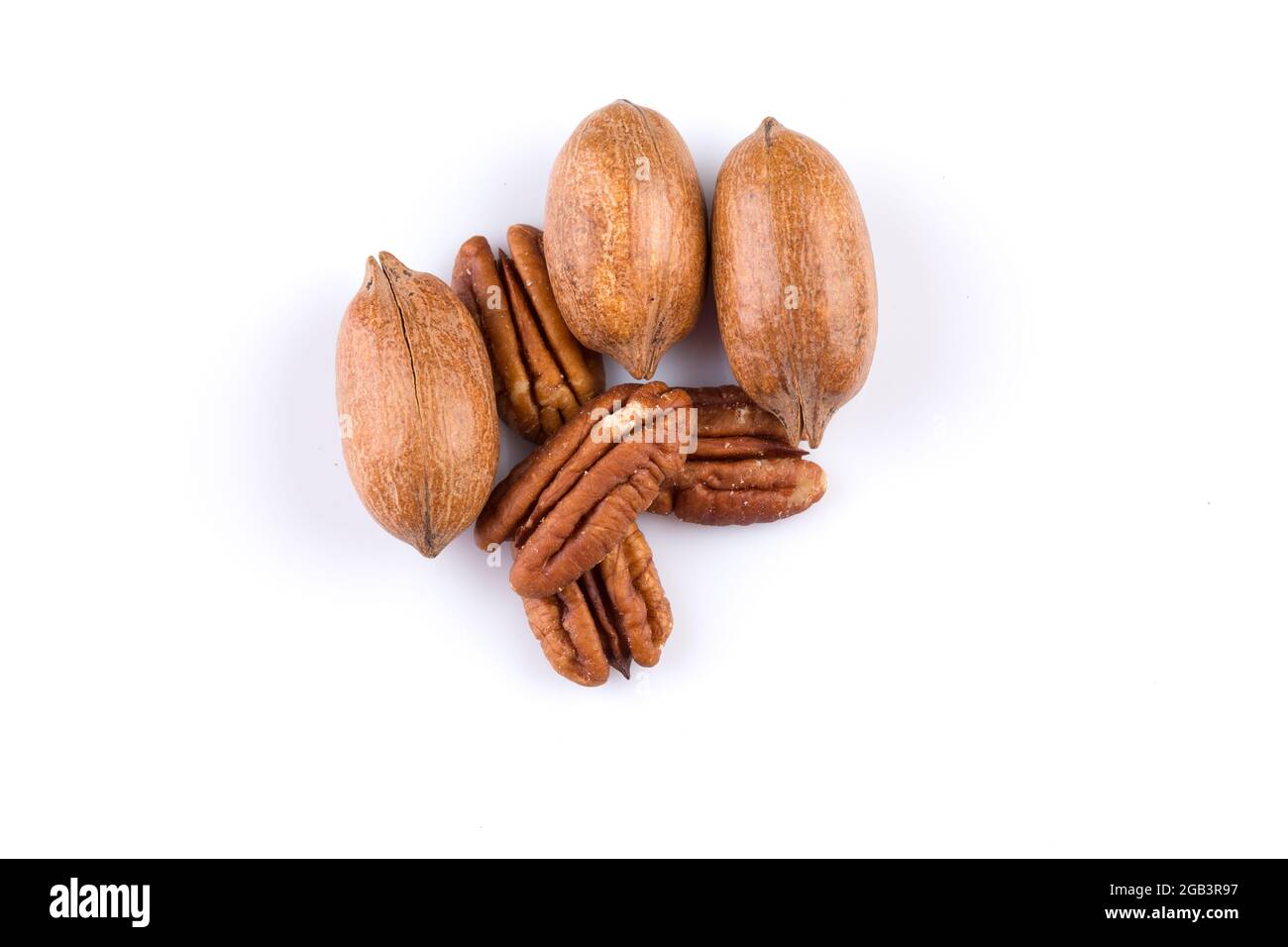 Few pecan nuts isolated on white background Stock Photo - Alamy