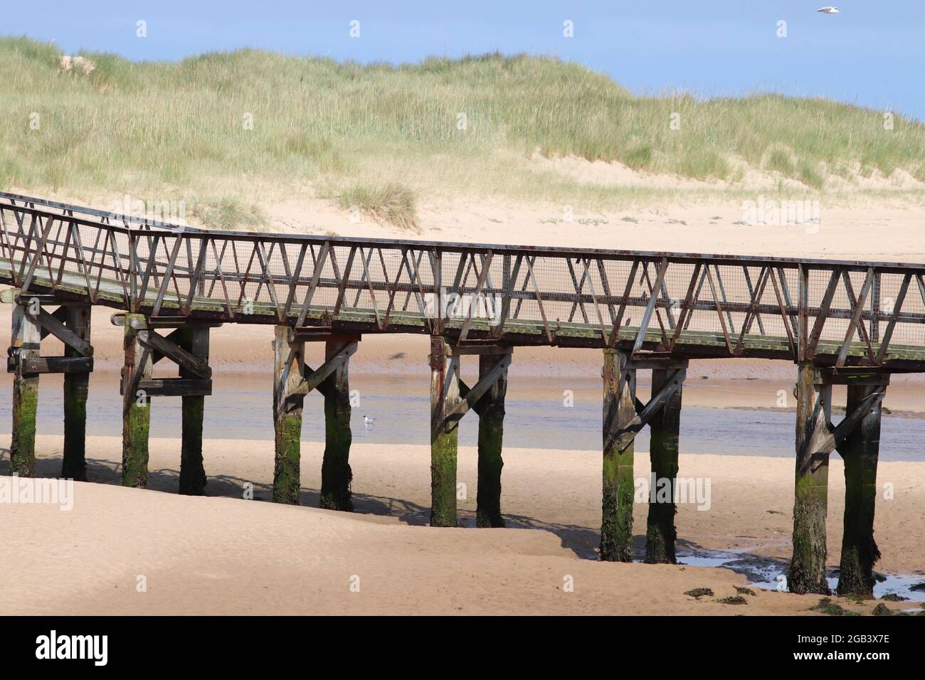 Old wooden bridge at beach Stock Photo - Alamy