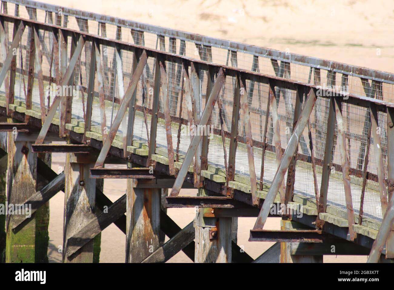 Old wooden bridge at beach Stock Photo - Alamy
