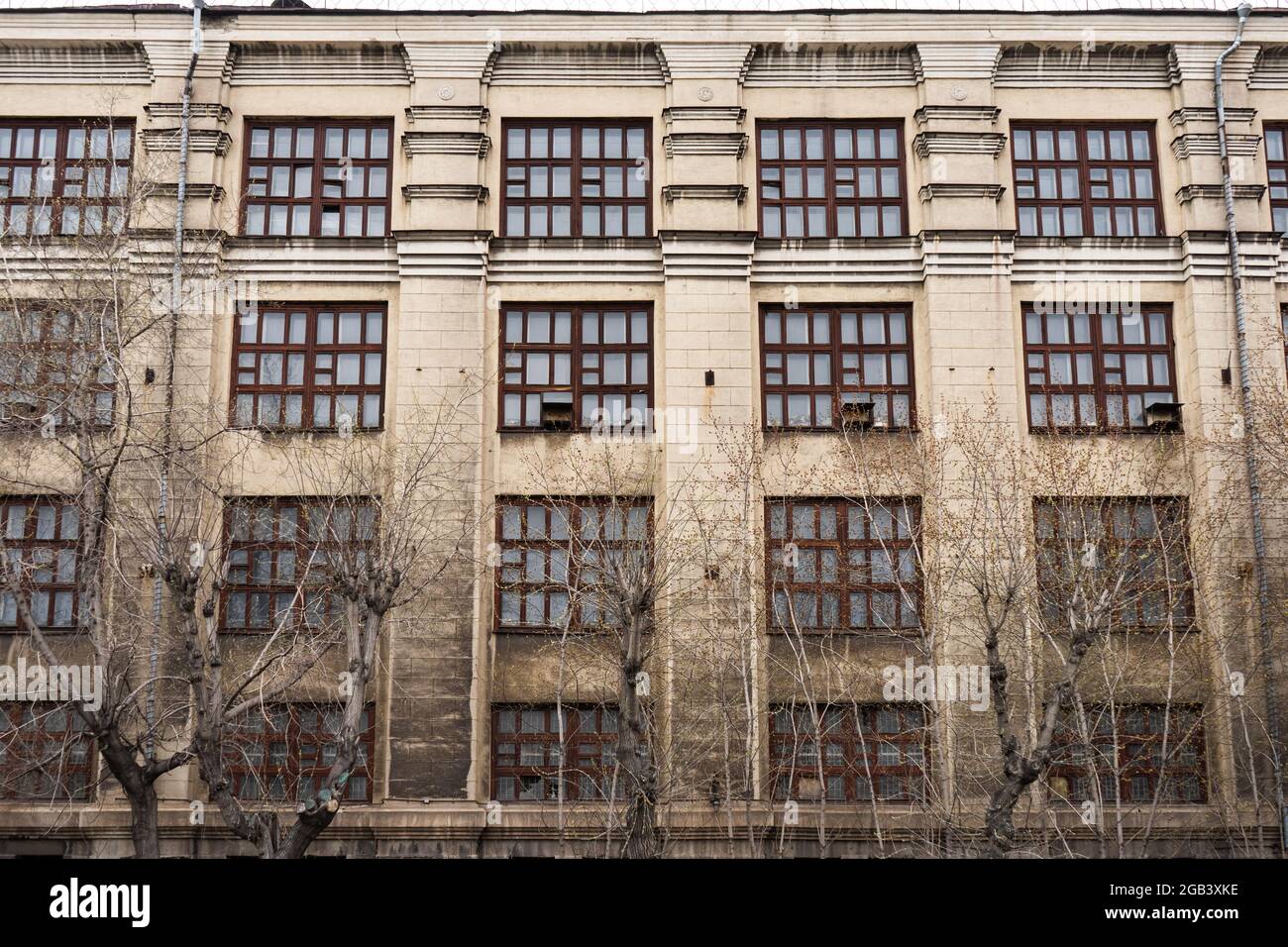 Vintage architecture classical facade old gray building front view. A ...