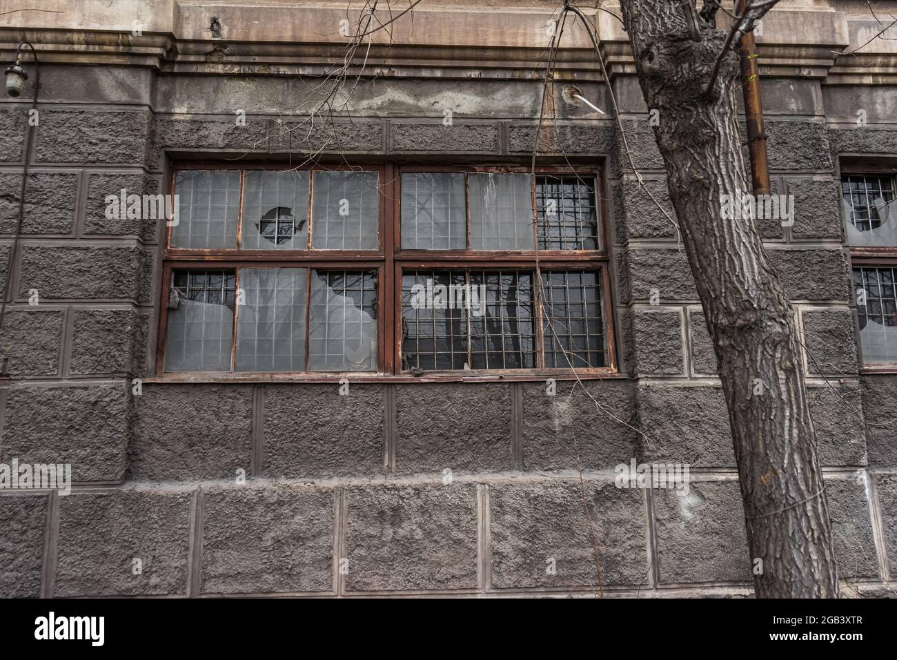 big dirty broken window. dark wall of a large house. Vintage ...