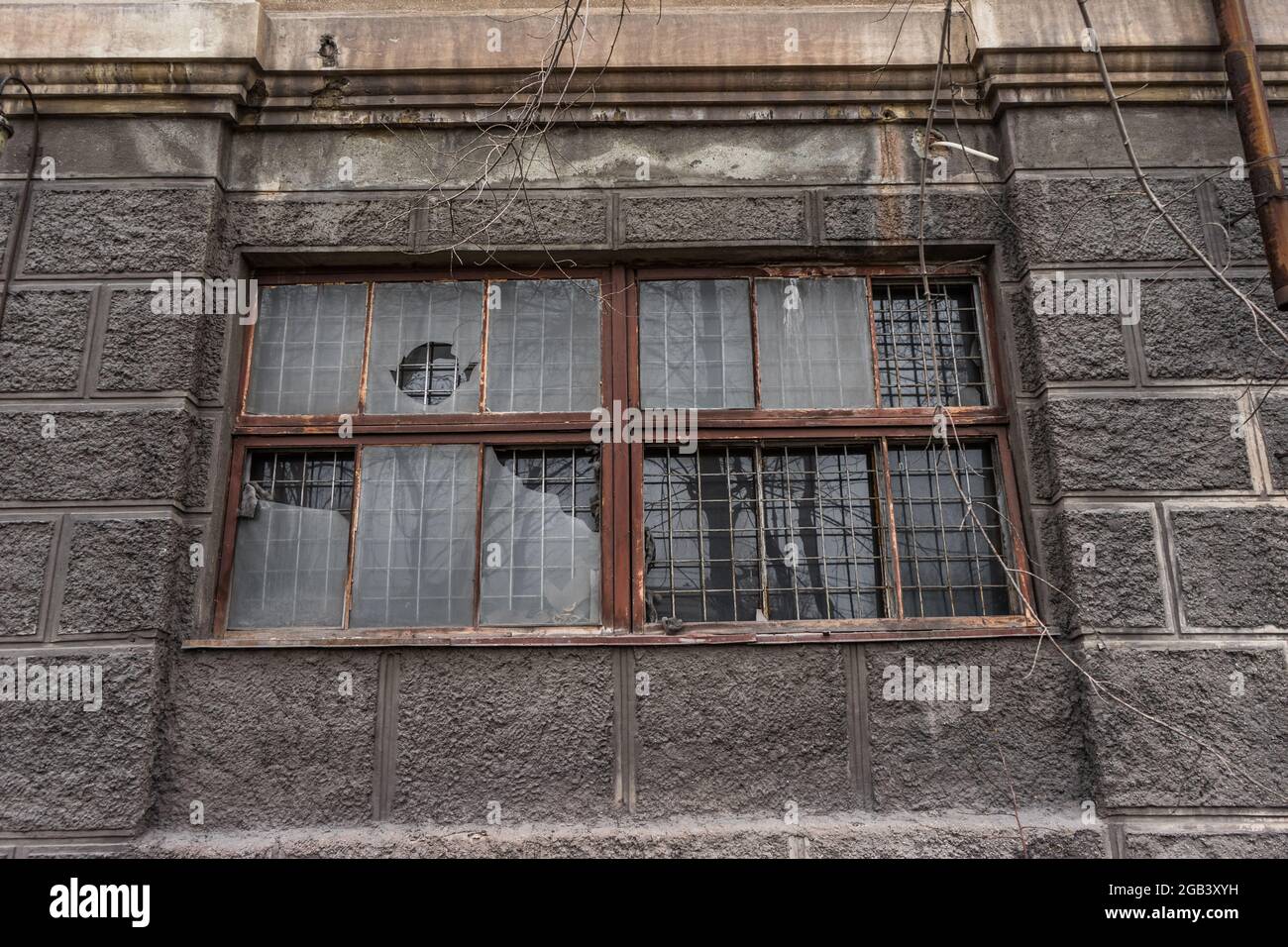 big dirty broken window. dark wall of a large house. Vintage ...