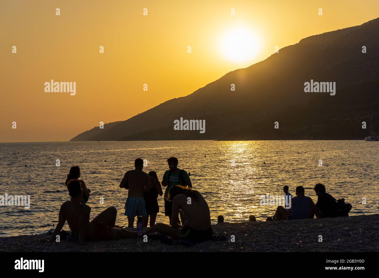 Susnet on beach hi-res stock photography and images - Alamy