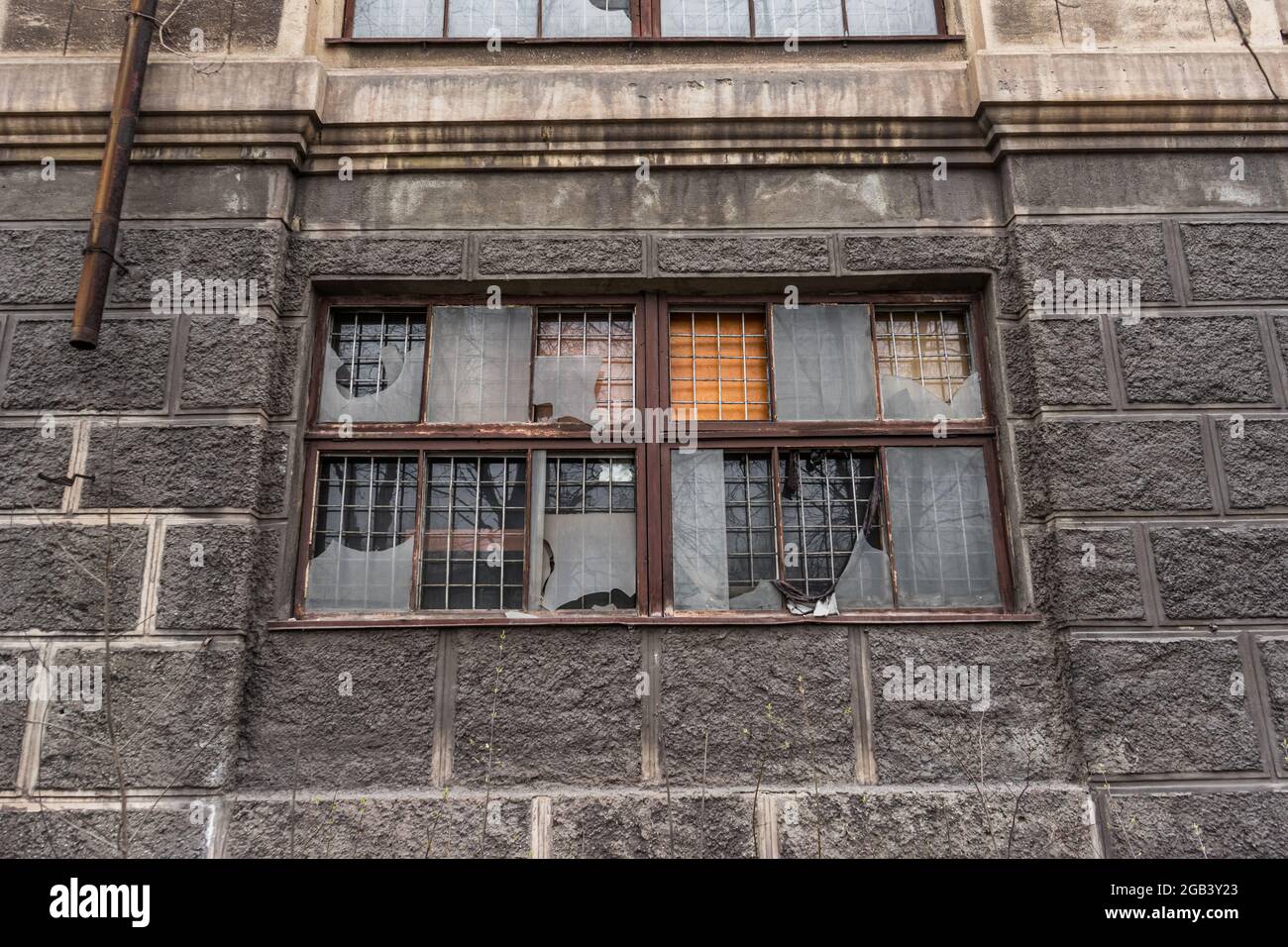 big dirty broken window. dark wall of a large house. Vintage ...