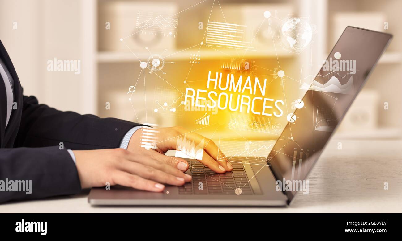 Side view of a business person working on laptop Stock Photo - Alamy