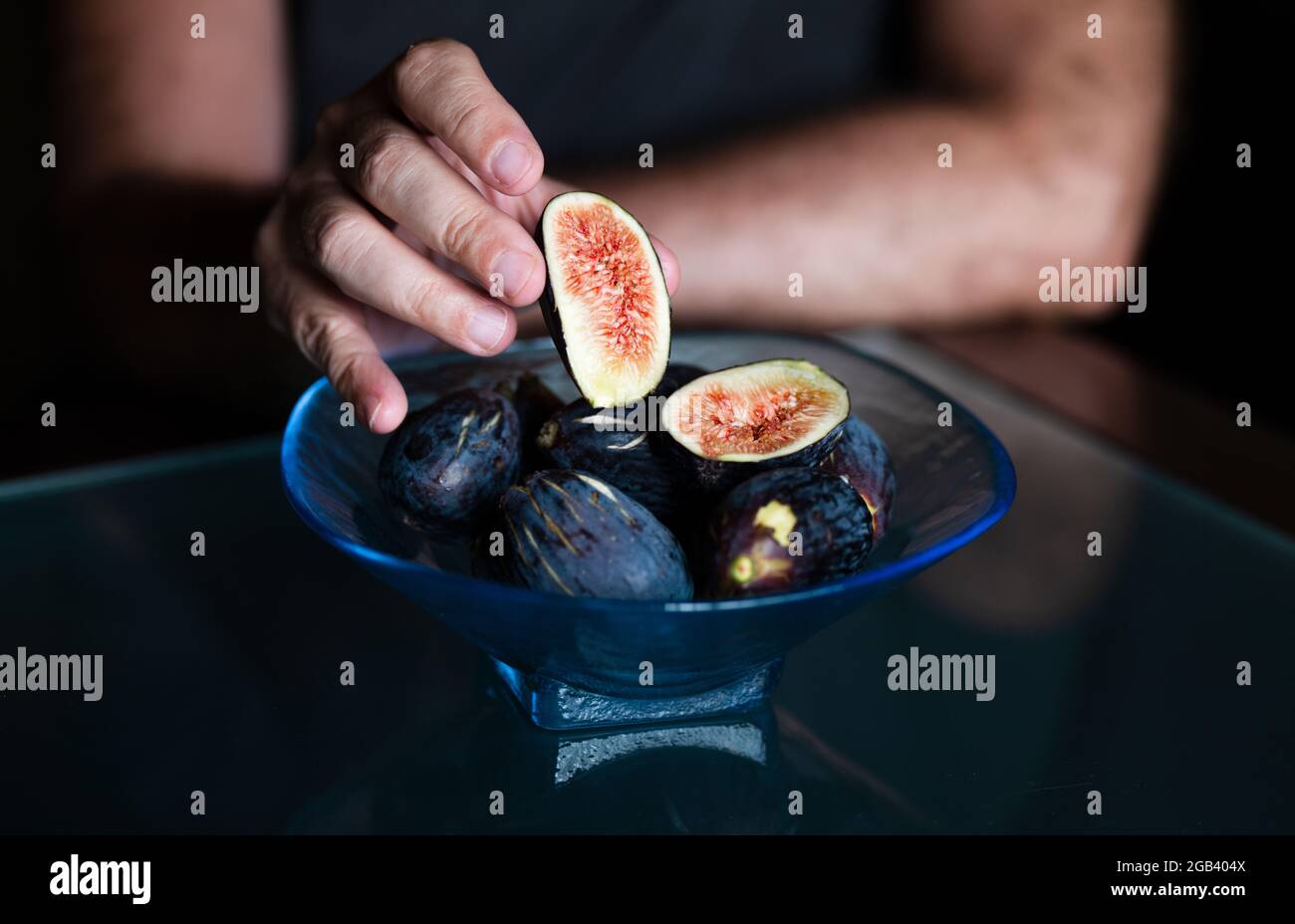 Figs in hand hi-res stock photography and images - Alamy