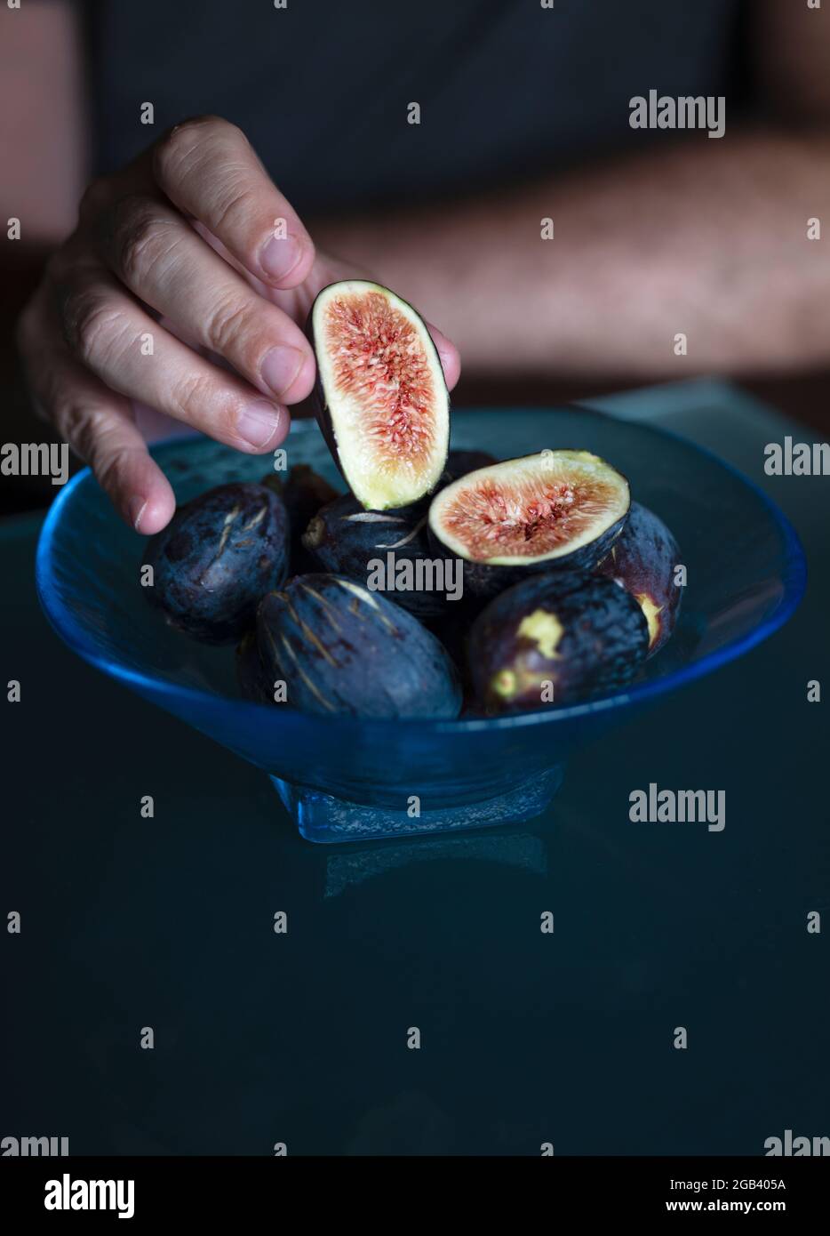 Figs in hand hi-res stock photography and images - Alamy