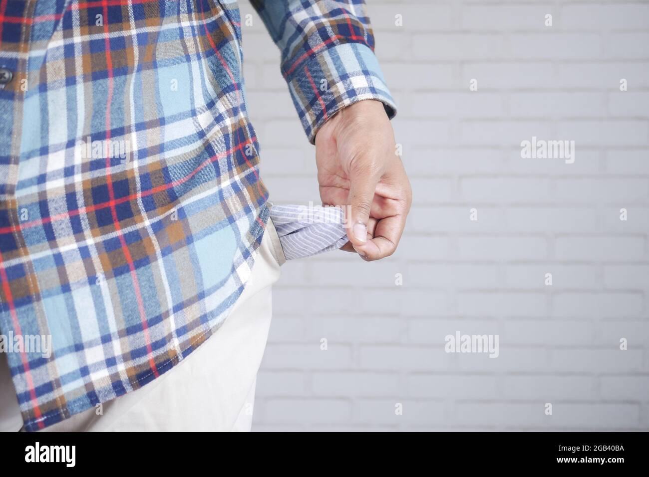 young man shows empty pant pocket with copy space Stock Photo - Alamy