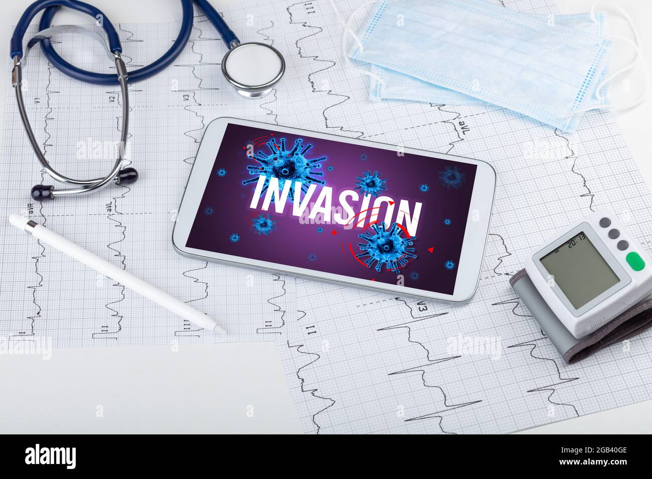 Tablet pc and doctor tools on white surface Stock Photo - Alamy