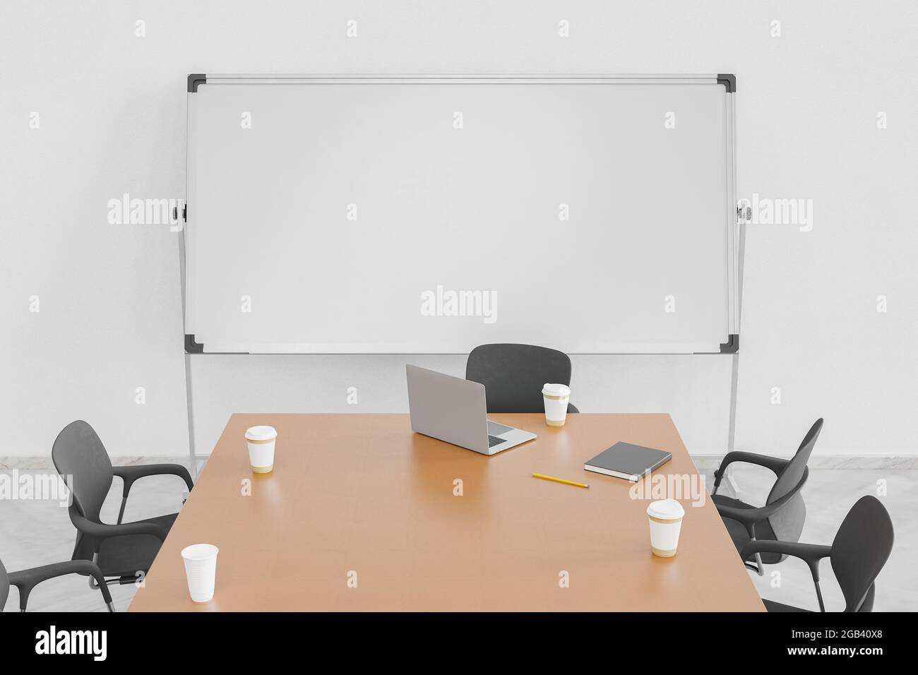 top view of an office table with laptop and coffee cups on top and a ...