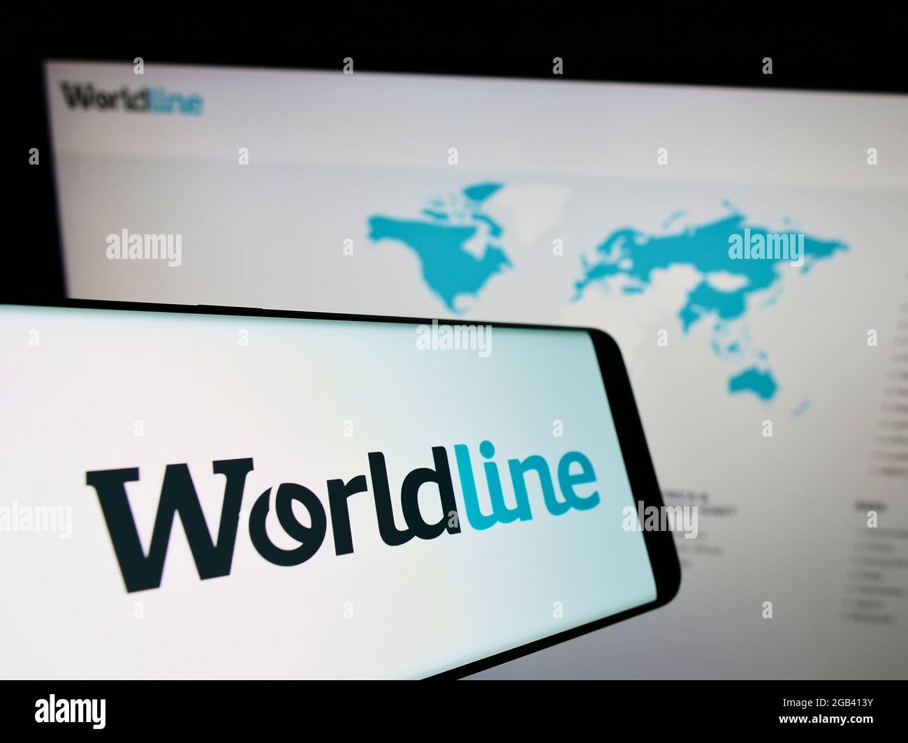Cellphone with logo of French payment company Worldline S.A. on screen ...