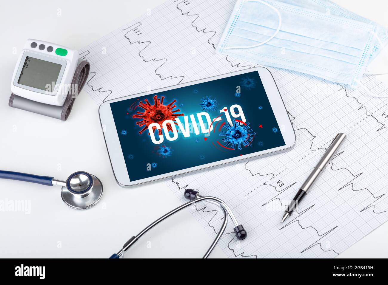 Tablet pc and doctor tools on white surface Stock Photo - Alamy