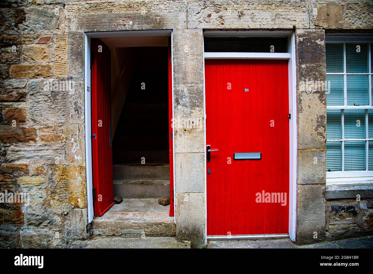 Medieval facade with red doors hi-res stock photography and images - Alamy