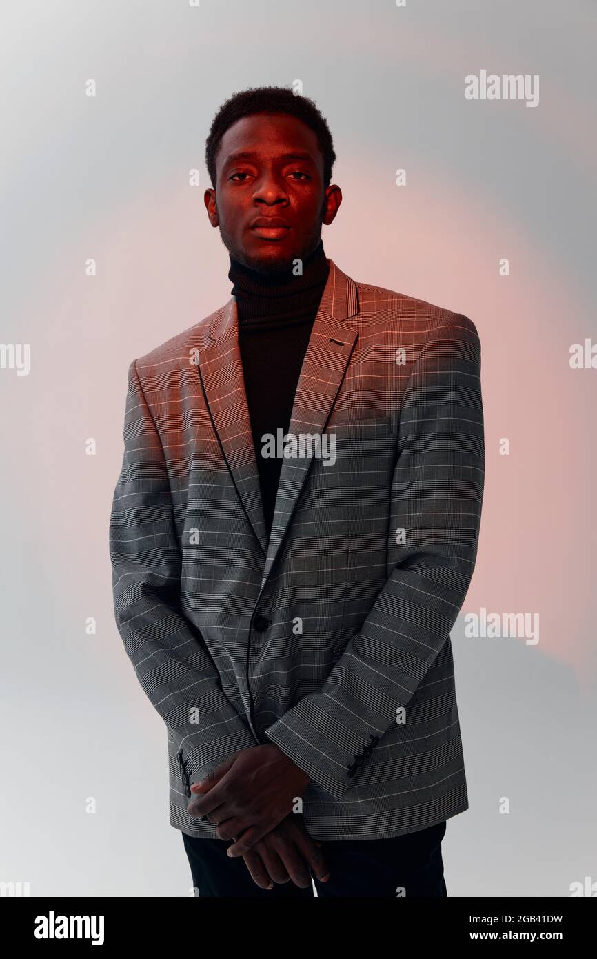 man of african appearance in a jacket fashion modern style Stock Photo ...