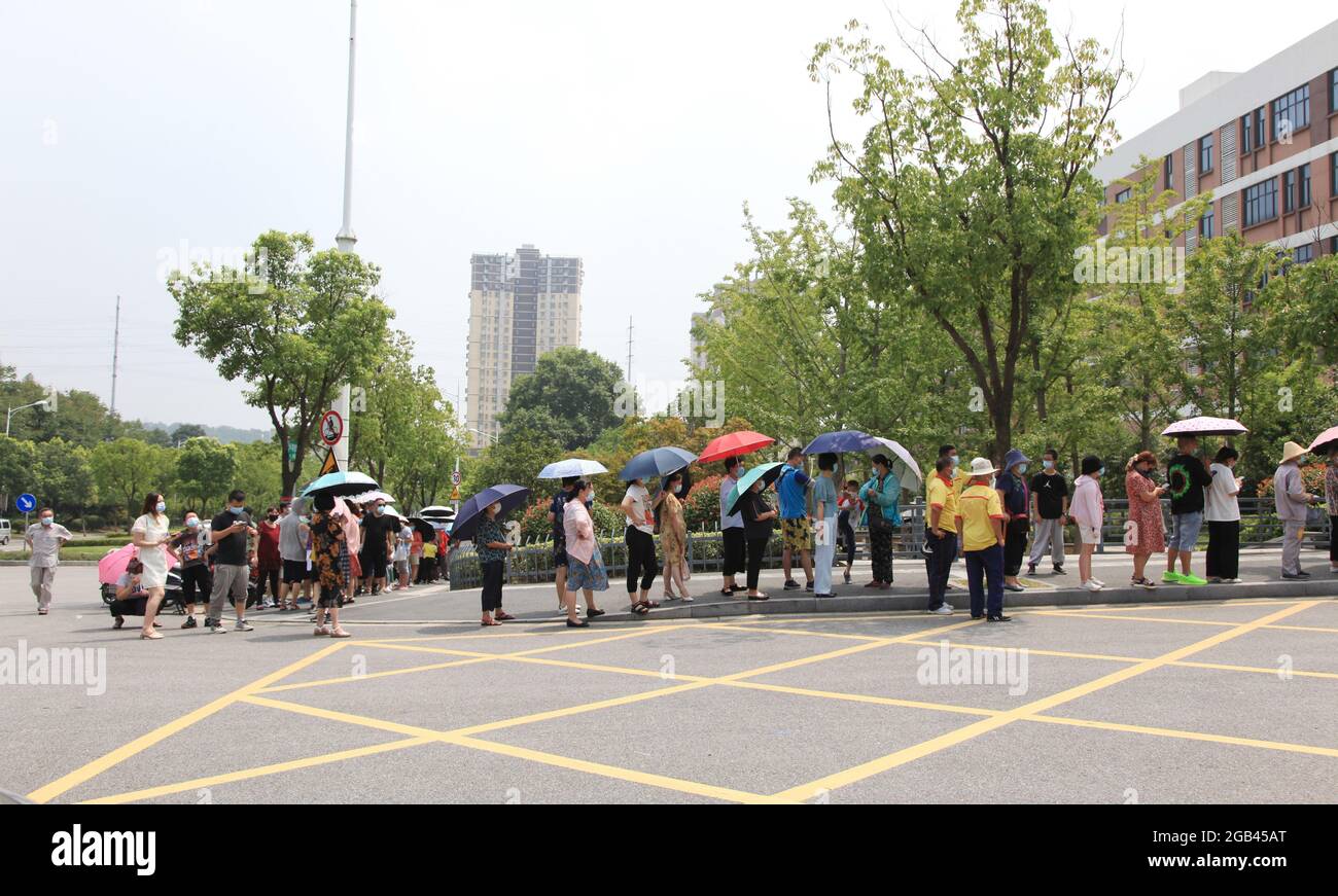 NANJING, CHINA - AUGUST 2, 2021 - Residents line up for the fourth ...