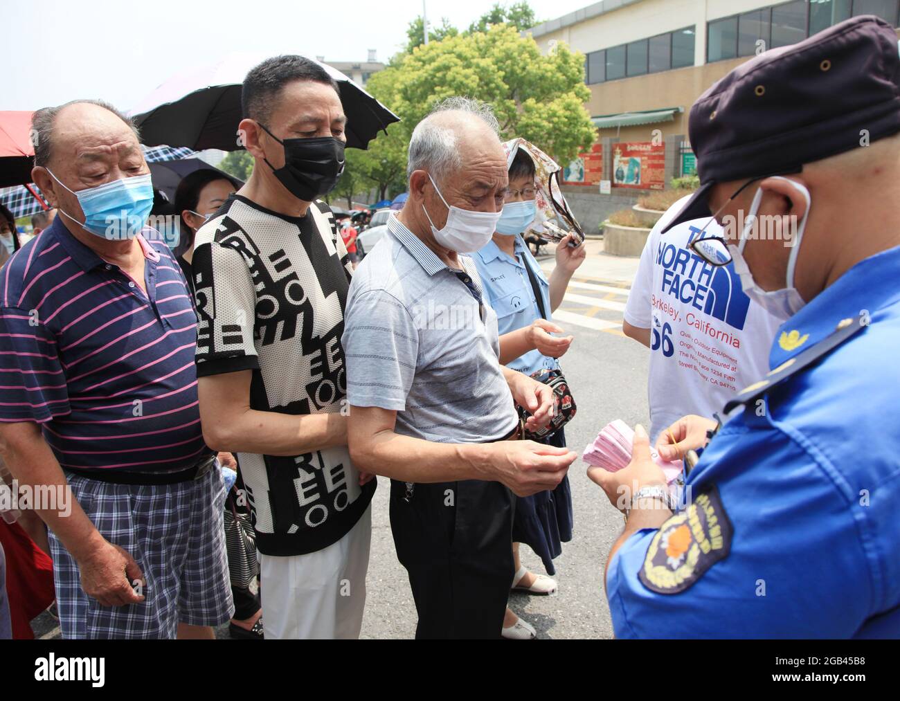 NANJING, CHINA - AUGUST 2, 2021 - Residents line up for the fourth ...