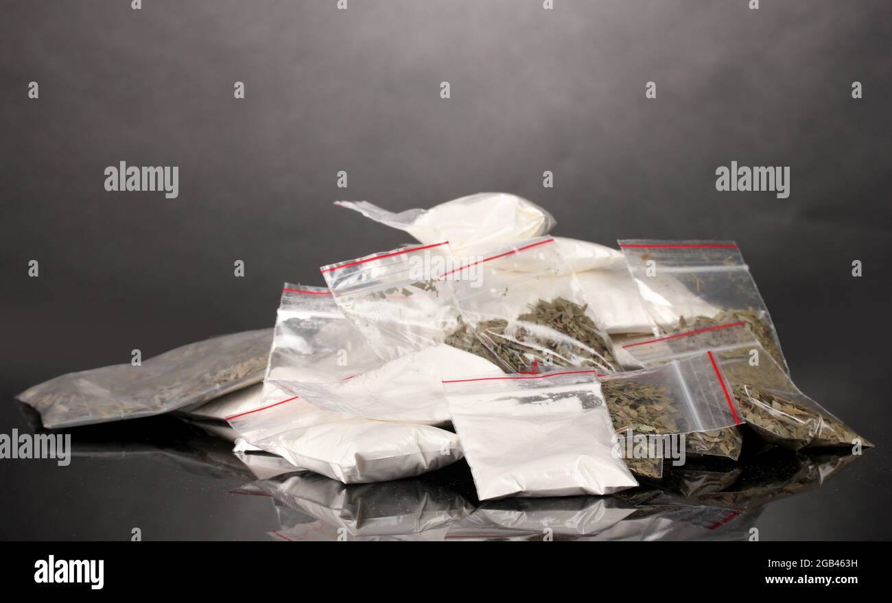 Cocaine and marihuana in packages on grey background Stock Photo - Alamy