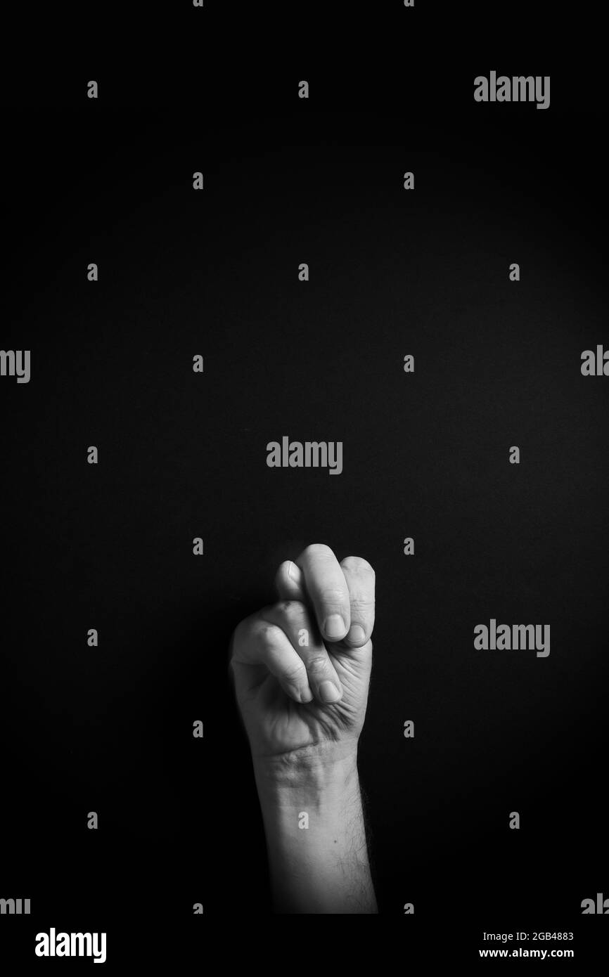 Dramatic B&W image of male hand demonstrating ASL American sign ...