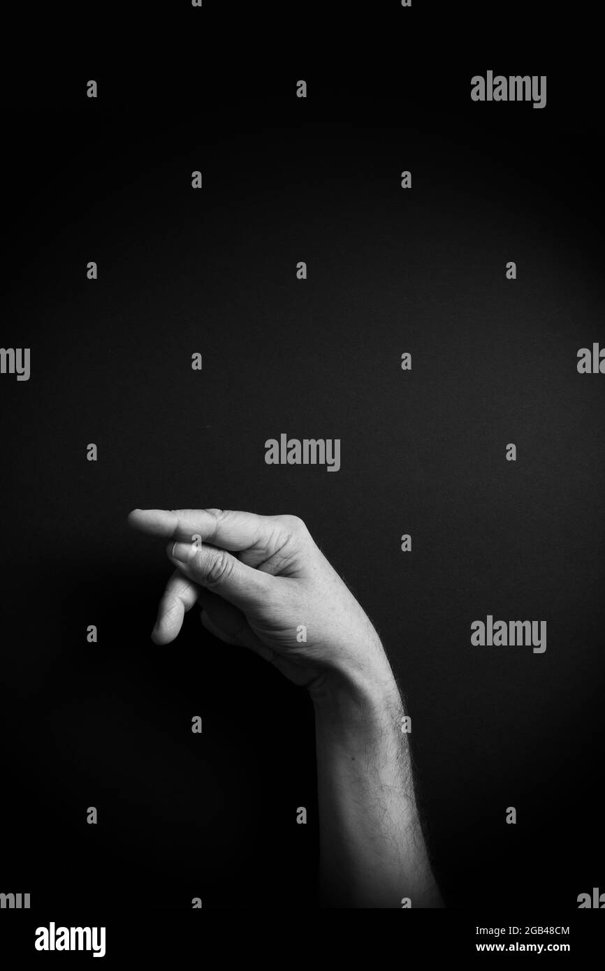 Dramatic B&W image of male hand demonstrating ASL American sign ...