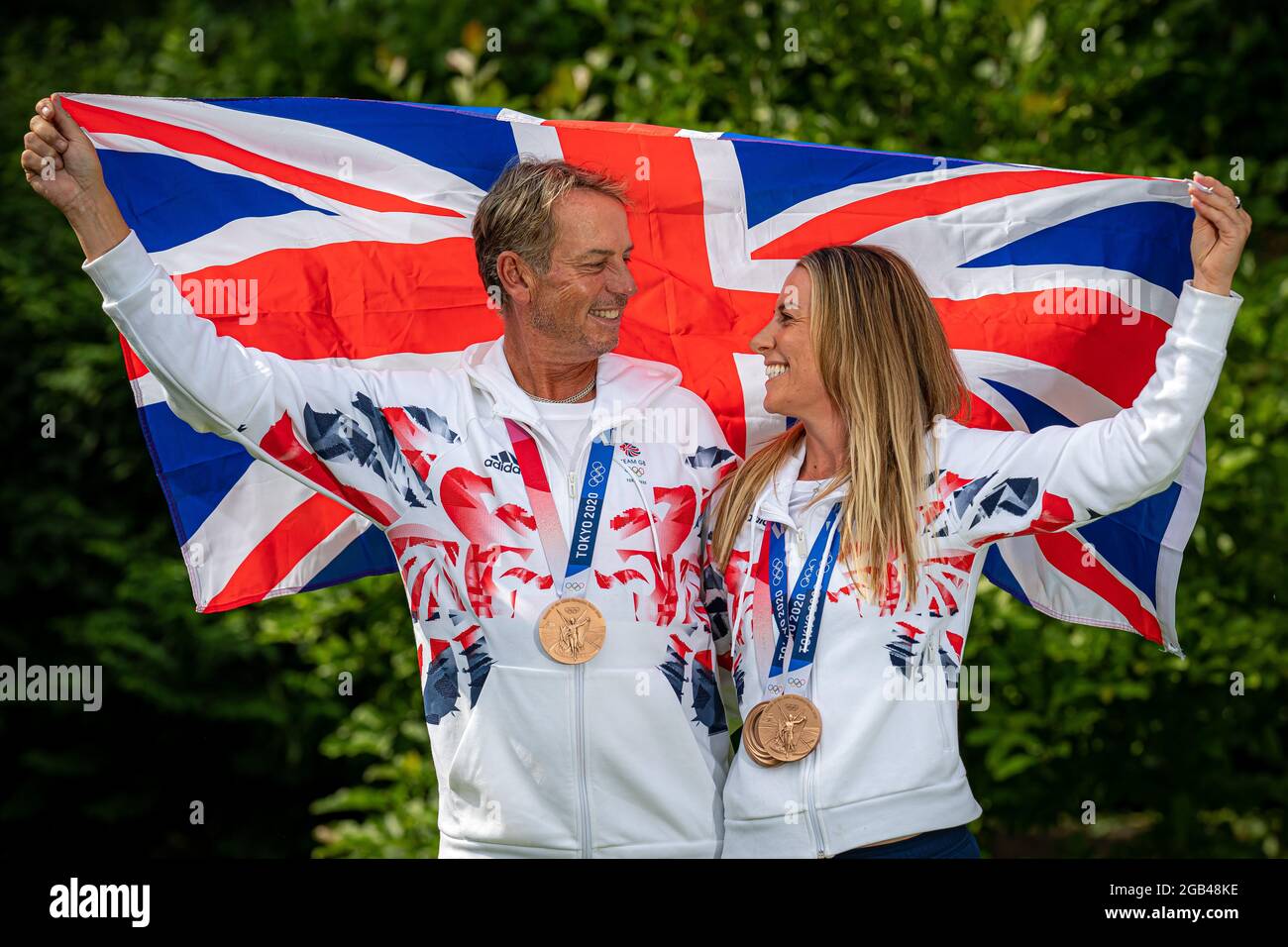 Carl Hester and Charlotte Dujardin raise the Union flag in celebration ...