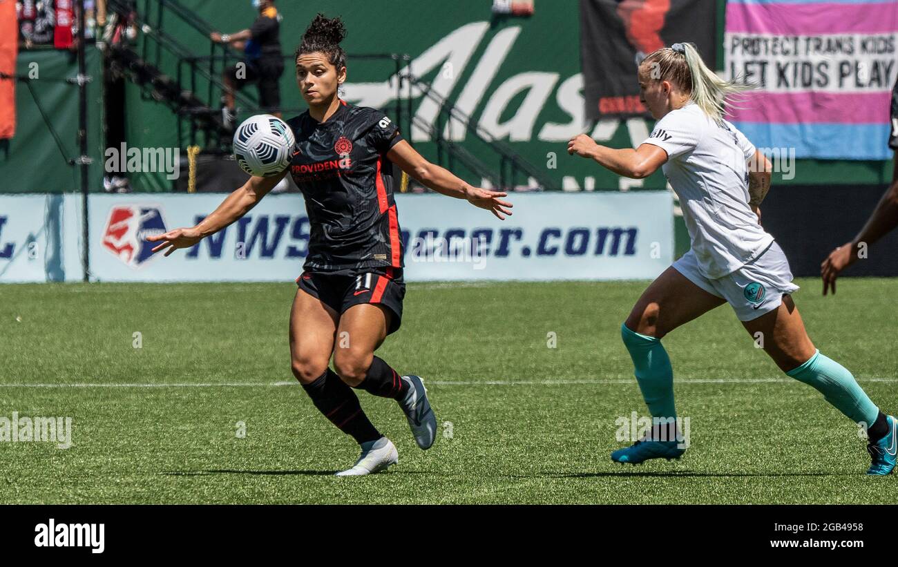 Portland's Rocky Rodriguez chests a ball with Kansas City's Kailie Mace ...