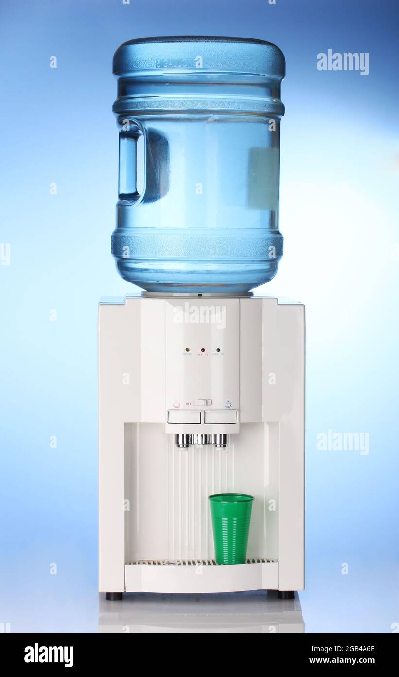 Electric water cooler on blue background Stock Photo - Alamy