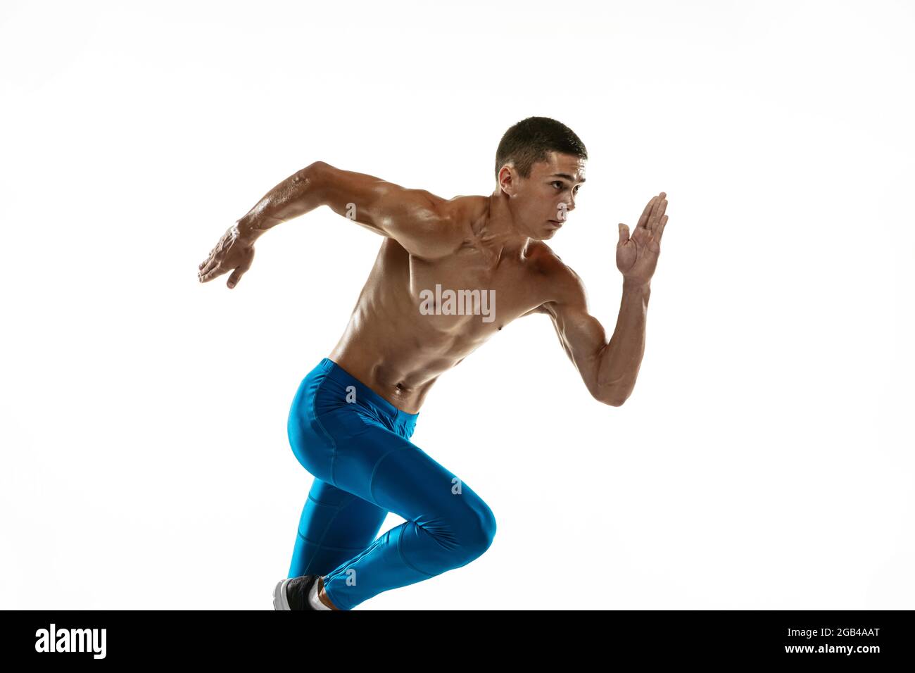 Close-up of Caucasian professional male athlete, runner training ...