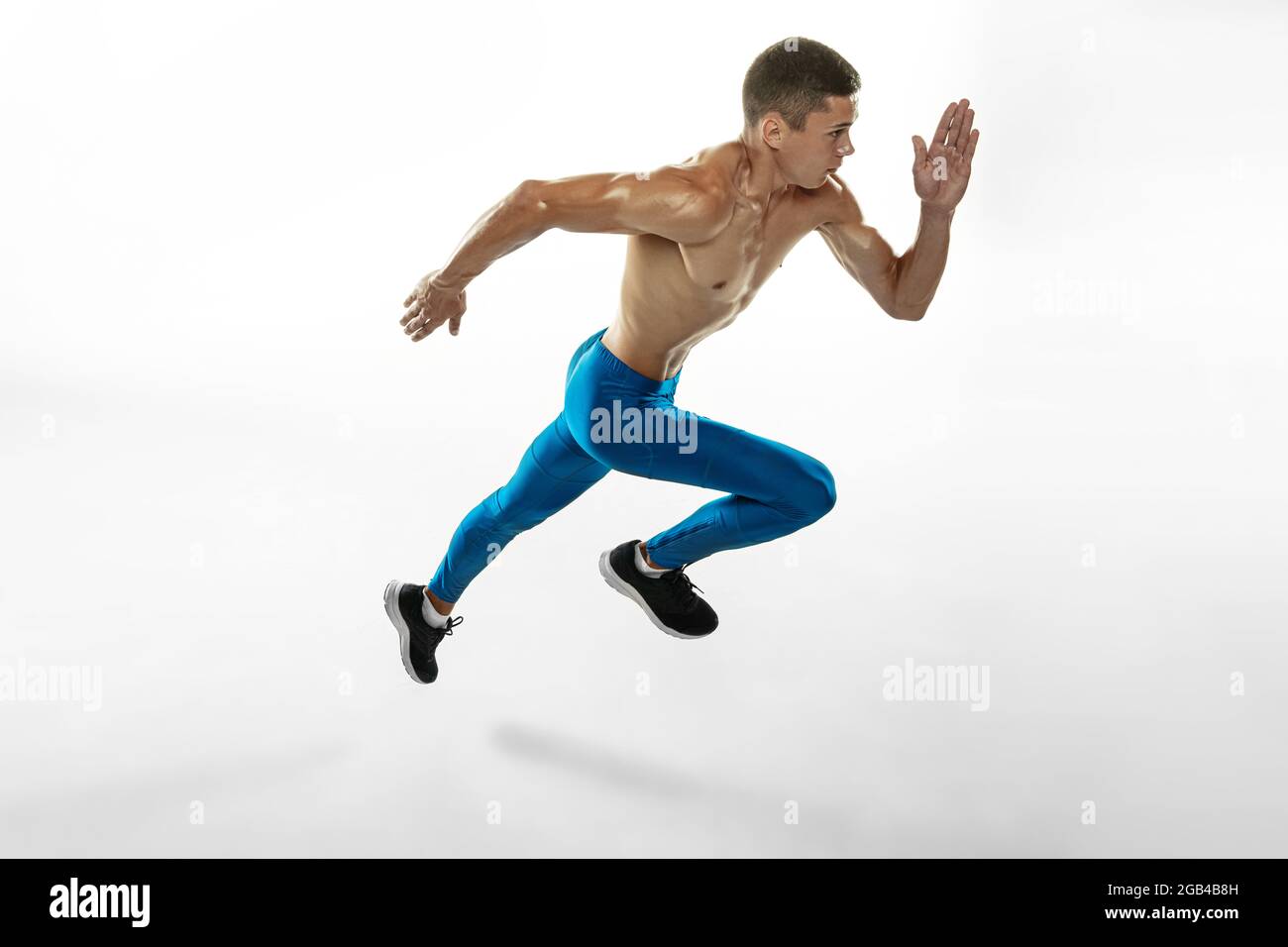 High angle view of young professional male athlete, runner training ...