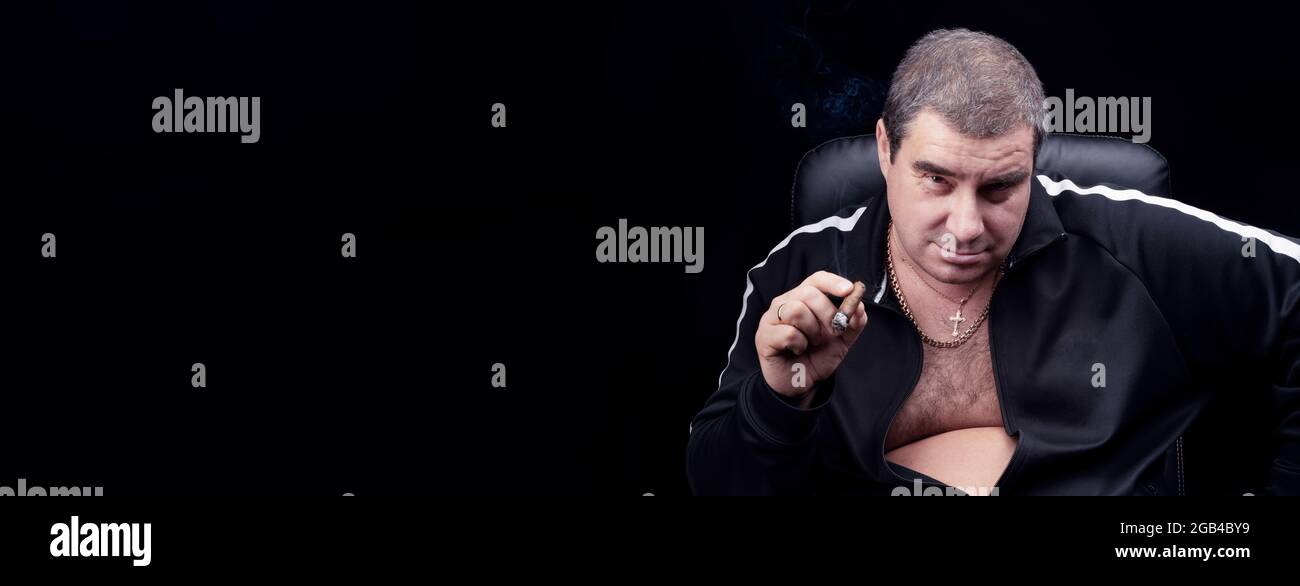 a funny and charming adult white man smokes a cigar and laughs and ...