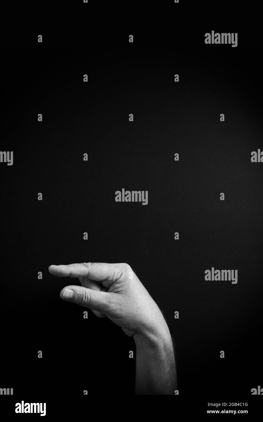 Dramatic B&W image of male hand demonstrating ASL American sign ...