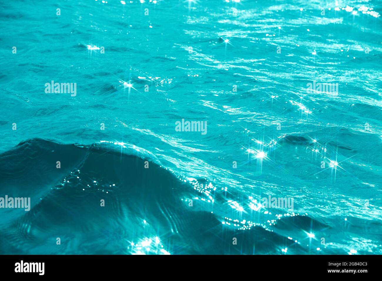 Detail of a sunlight reflecting in glittering sea. sparkler in water ...